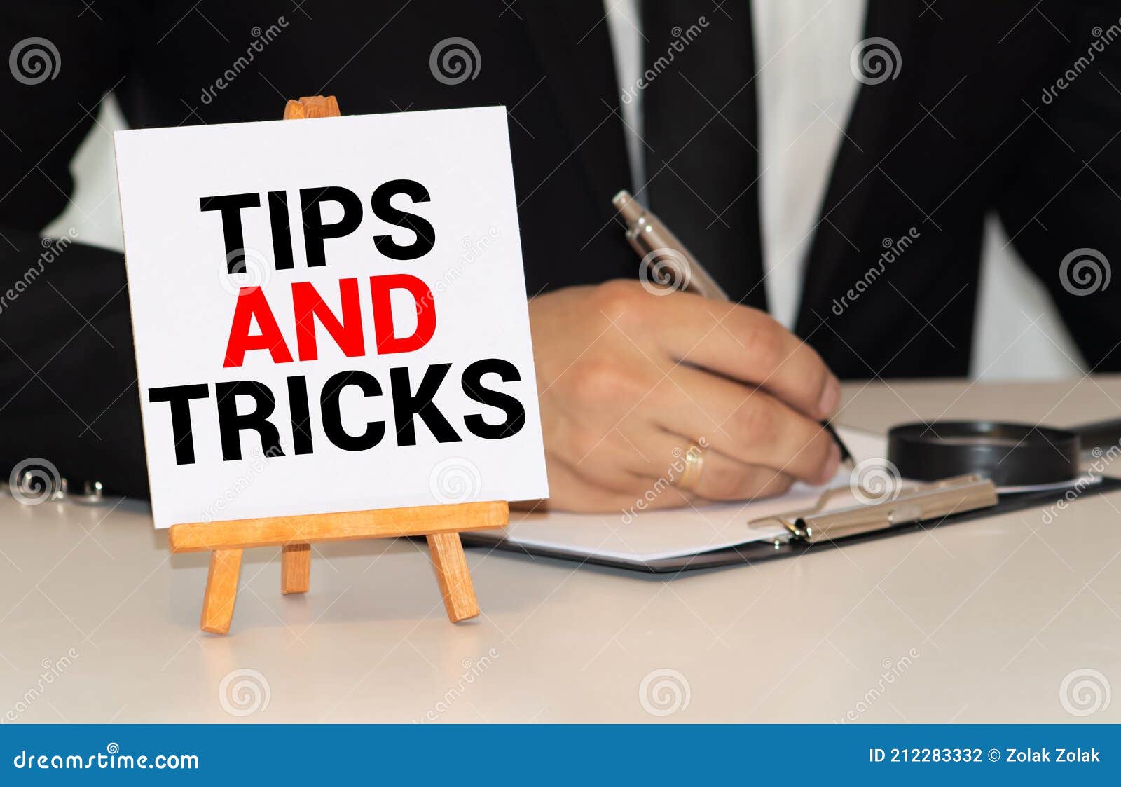 Tips and Tricks on Note Book with Hand on Desk Stock Photo - Image of ...