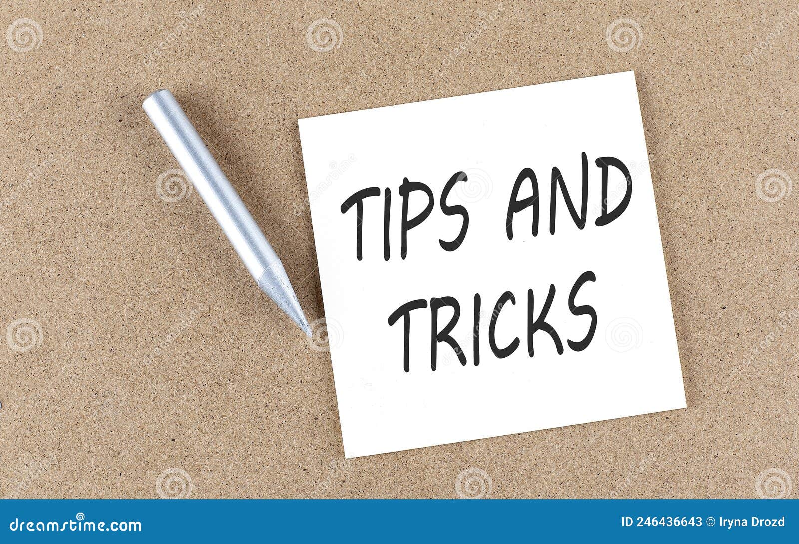 TIPS and TRICKS Text on Sticky Note on a Cork Board with Pencil Stock ...