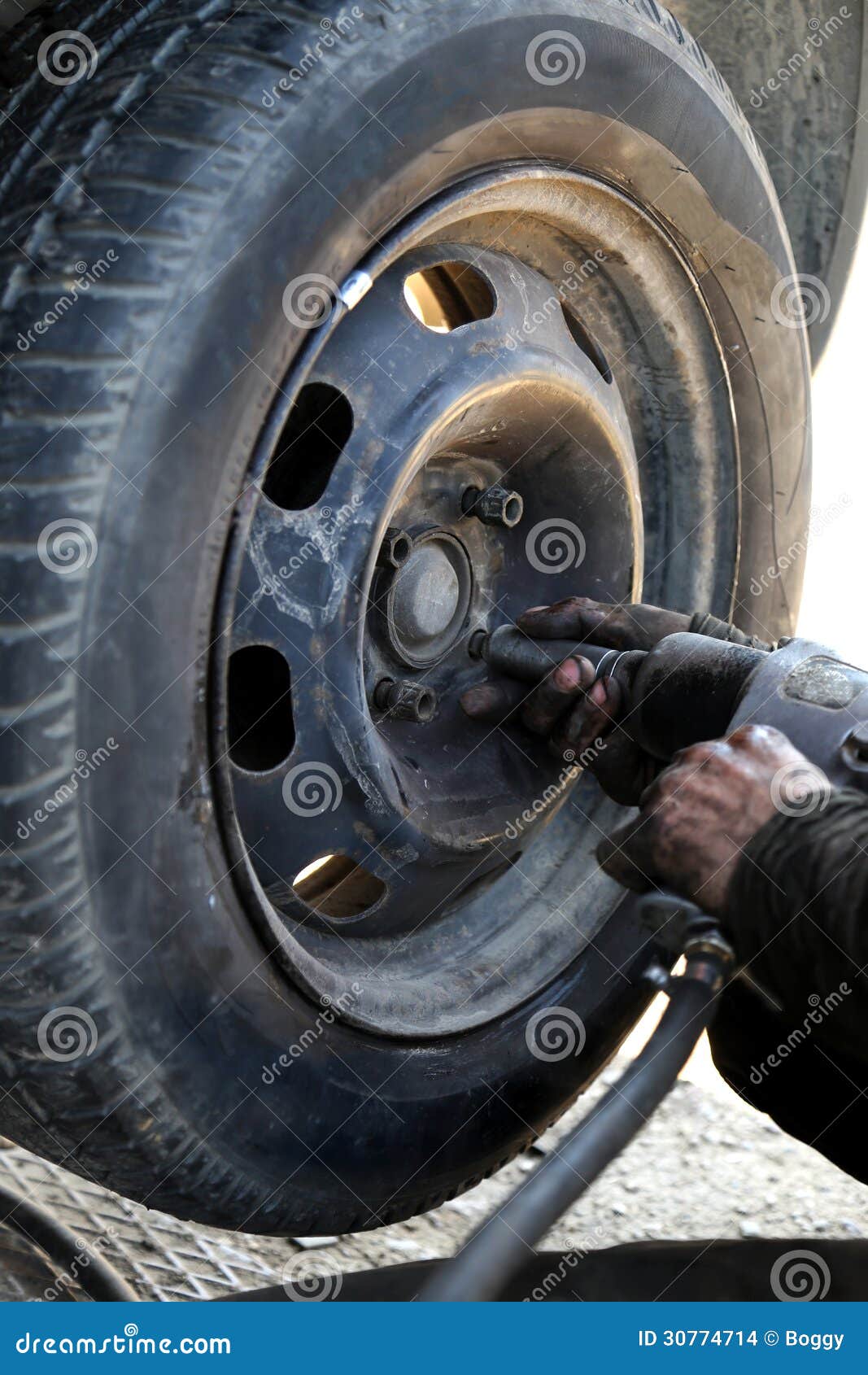 Tire changing stock photo. Image of mechanic, removing - 30774714