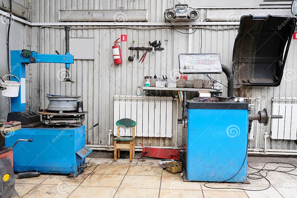 Tire fitting machine stock photo. Image of equipment - 82641728