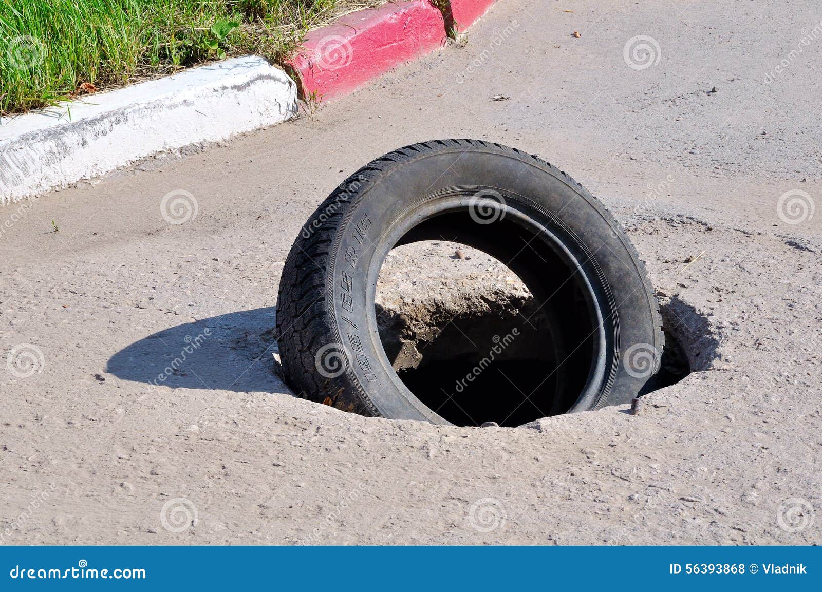 Hatch Of Well Is Closed With Round Metal Cover. Sewer Well With Manhole ...