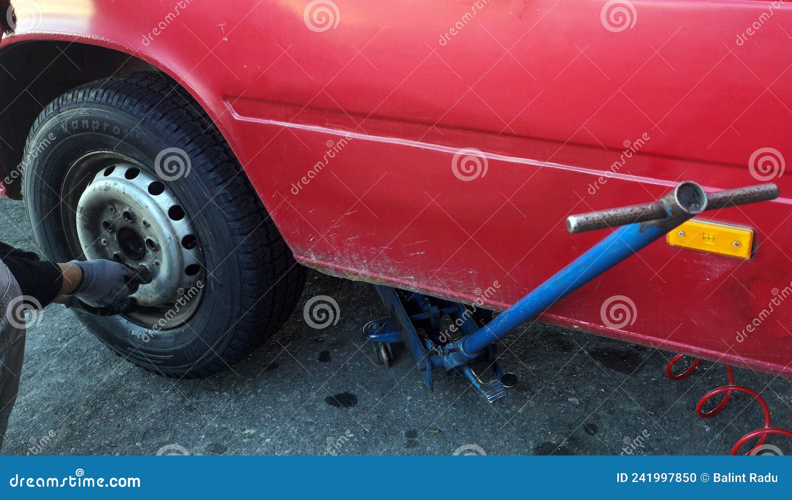 Auto Mechanic Man Changing Tire Stock Photo - Image of mechanic ...