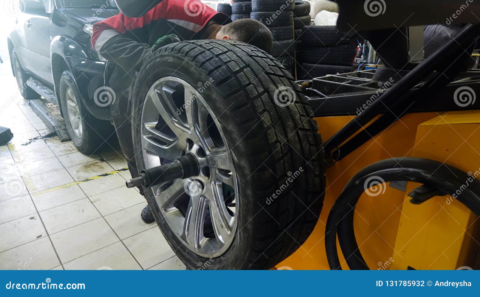 Replacing Wheels On A Car Editorial Photo | CartoonDealer.com #168277365