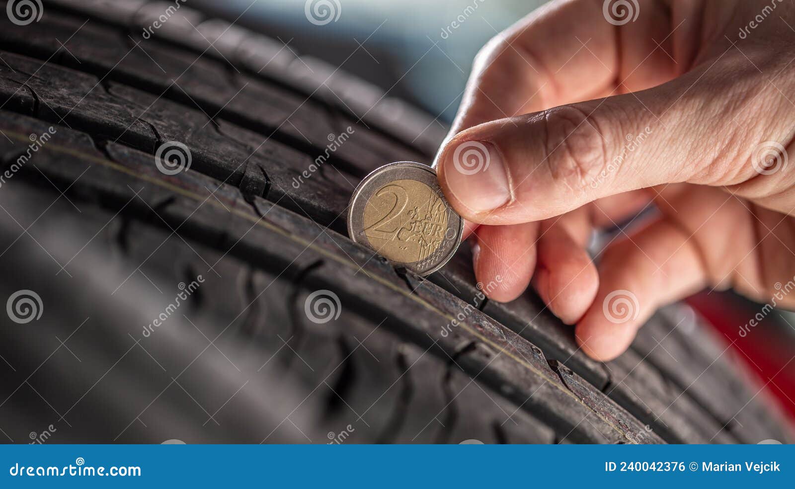 Tire Tread Measuring by a Two Euro Coin Placed into the Pattern of the ...