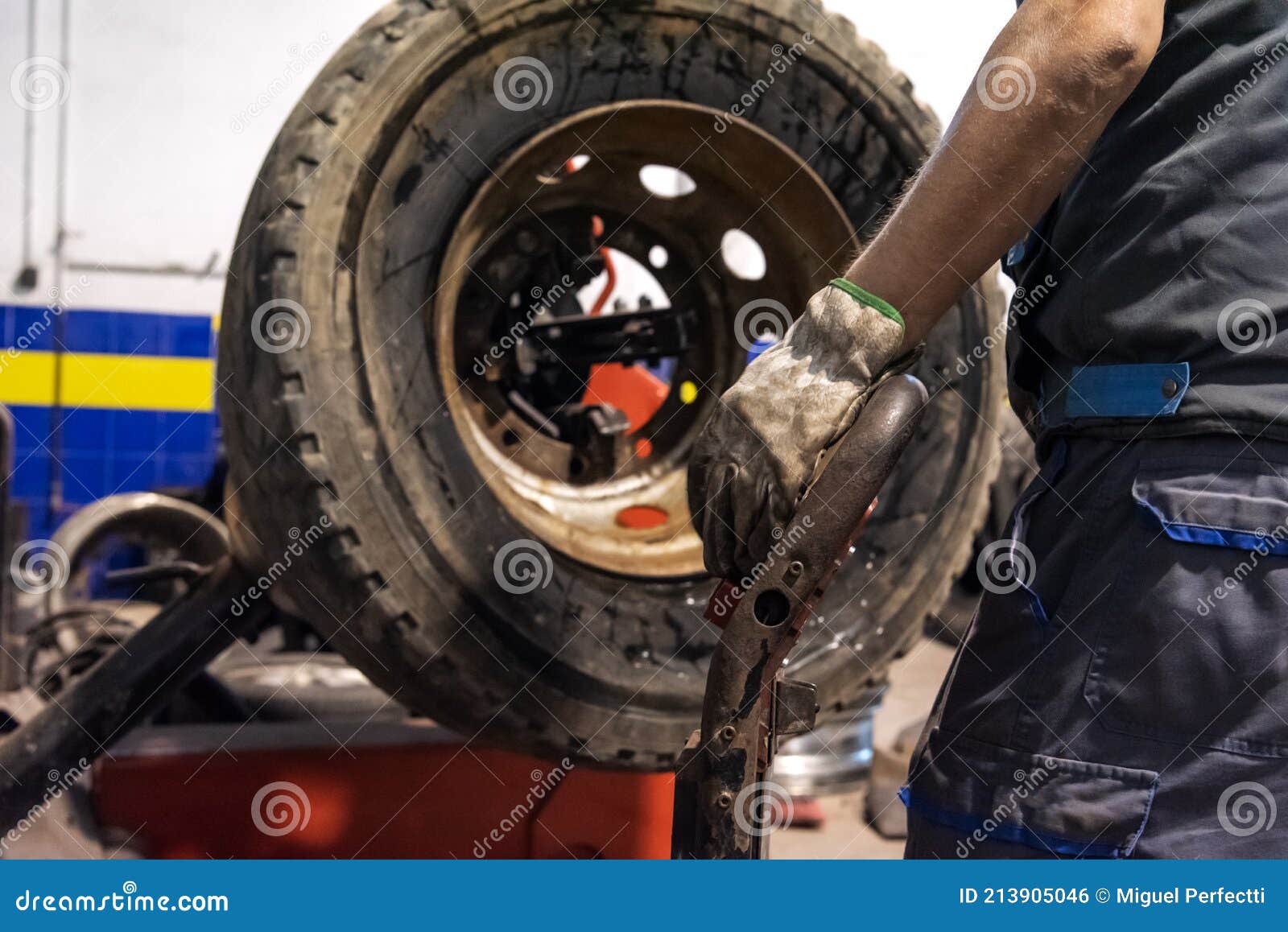 Tire workshop operator stock photo. Image of disc, repair - 213905046