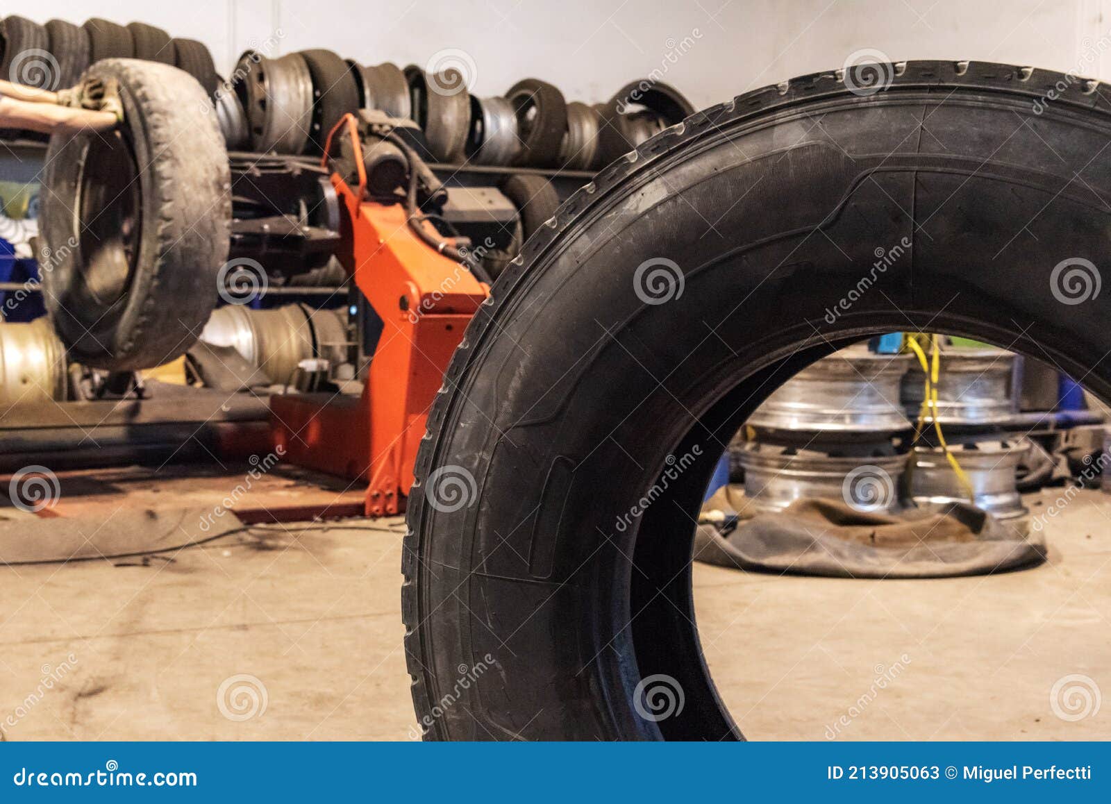 Tire workshop operator stock image. Image of workshop - 213905063