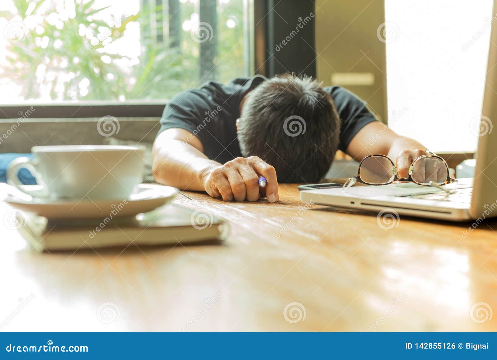Tired Asian Man with Head Down on Computer Laptop while Working. Stock ...