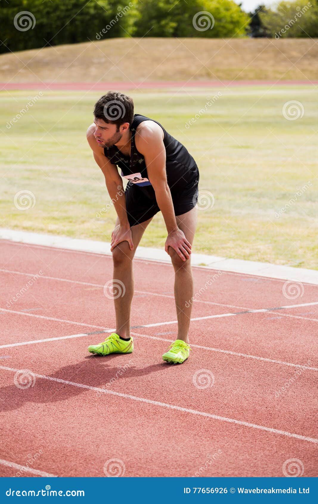 Tired Athlete Standing on Running Track Stock Photo - Image of sunny ...