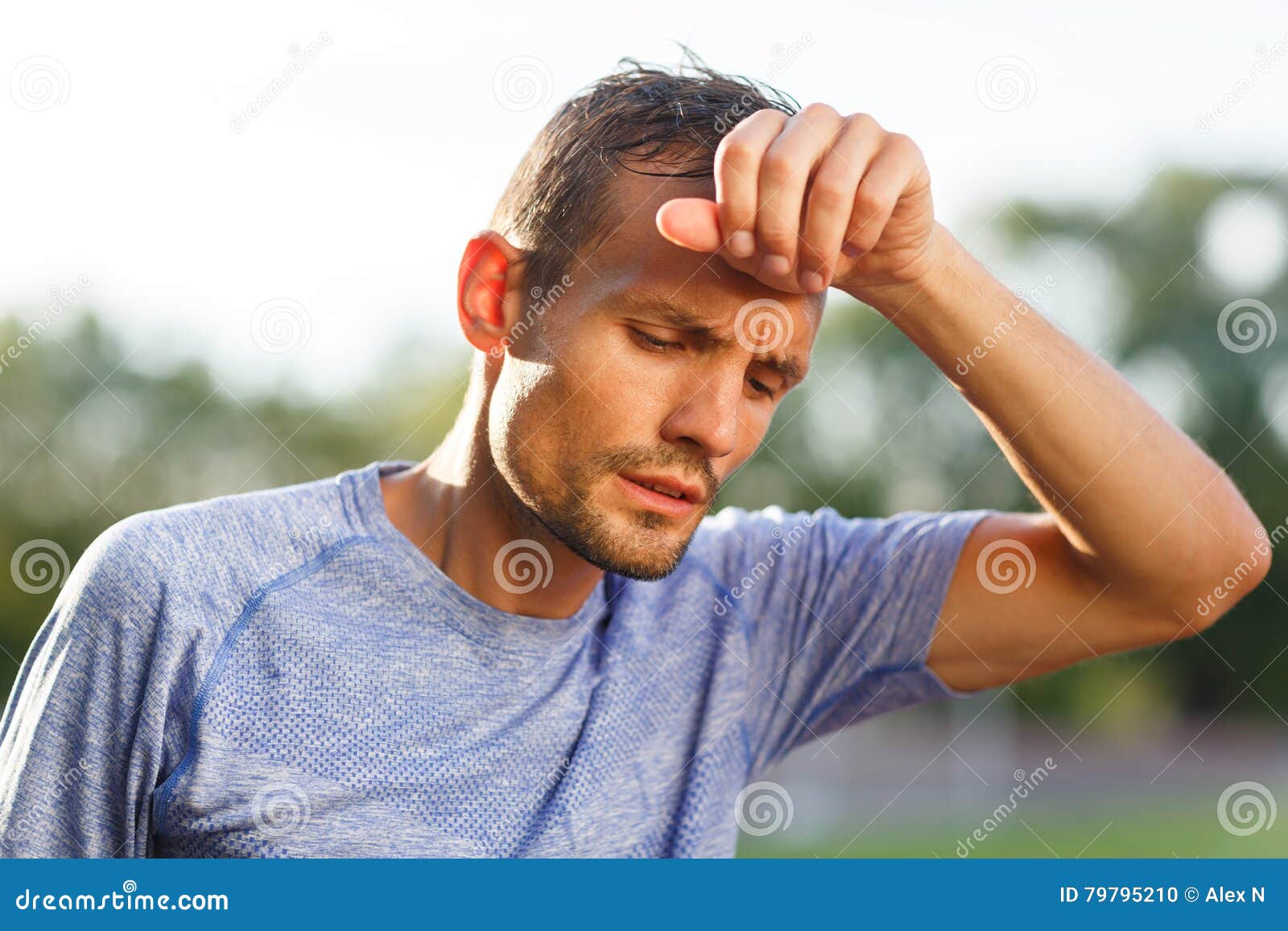 Tired Athlete Wiping with Hand Sweat from Forehead Closeup Stock Photo ...