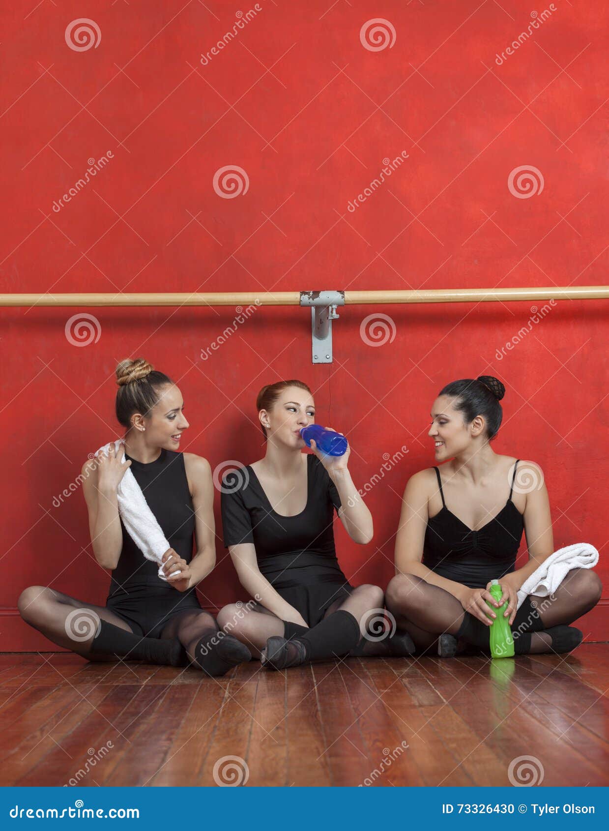 Tired Ballet Dancers Sitting on Hardwood Floor Stock Photo - Image of ...