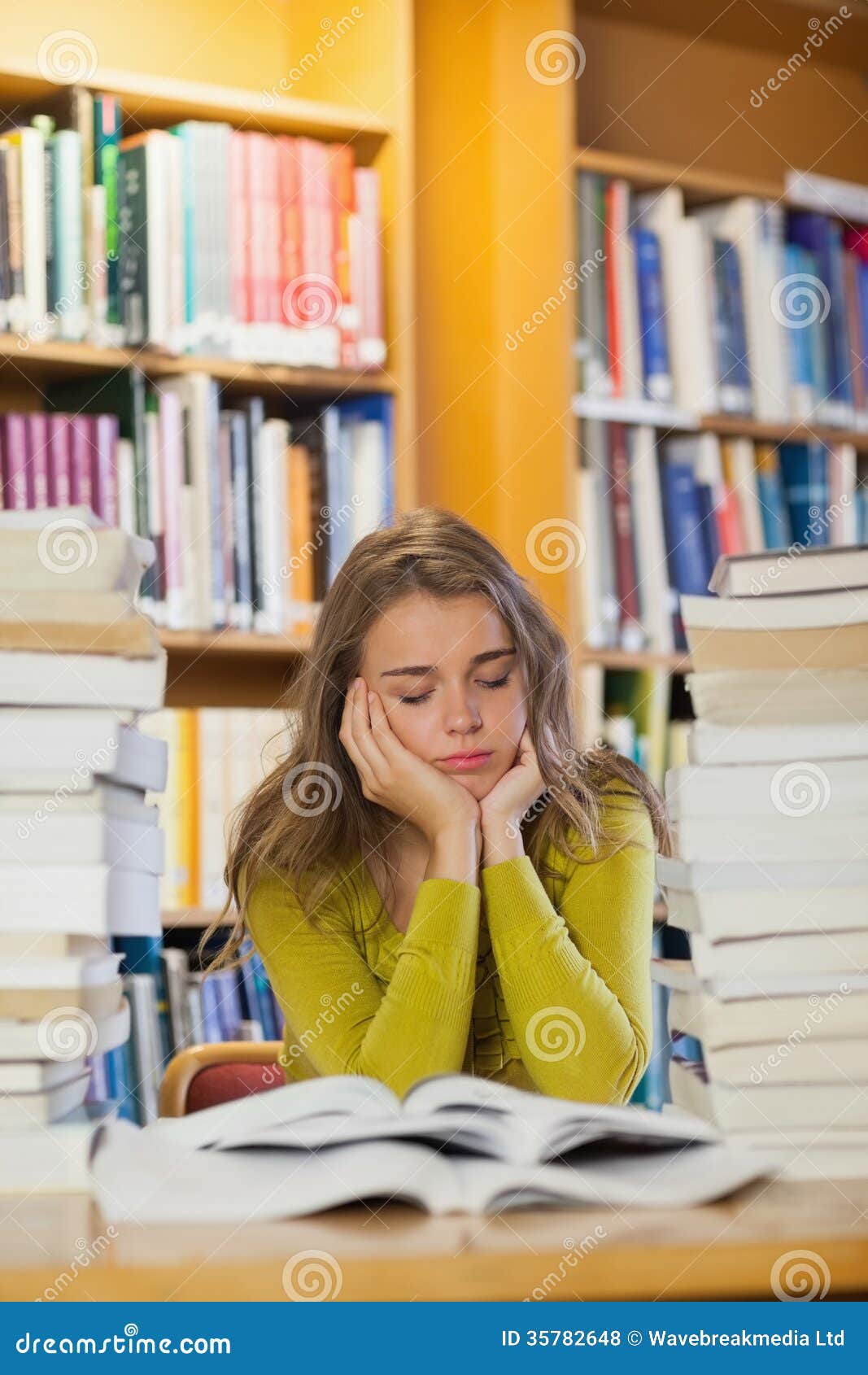 Tired Beautiful Student Studying between Piles of Books with Closed ...