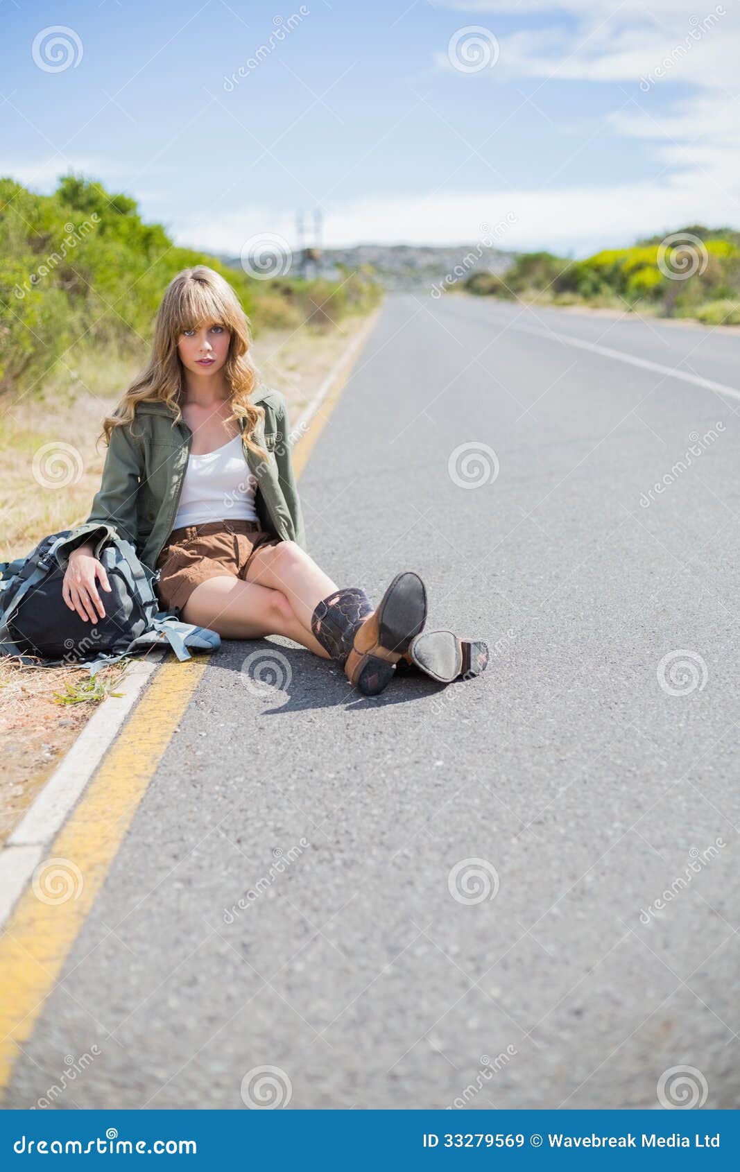 Tired Blonde Woman Sitting on the Roadside Stock Image - Image of blue ...