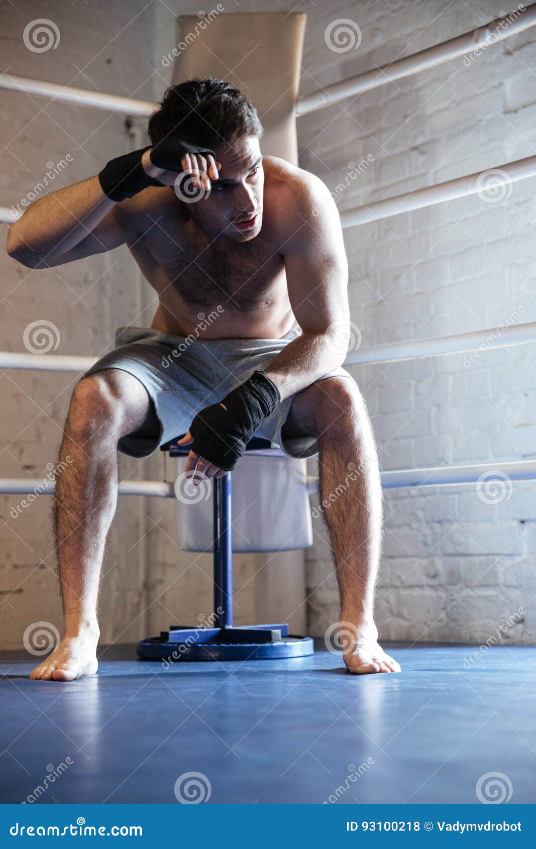 Tired Boxer Wiping the Sweat while Sitting on Ring Stock Photo - Image ...