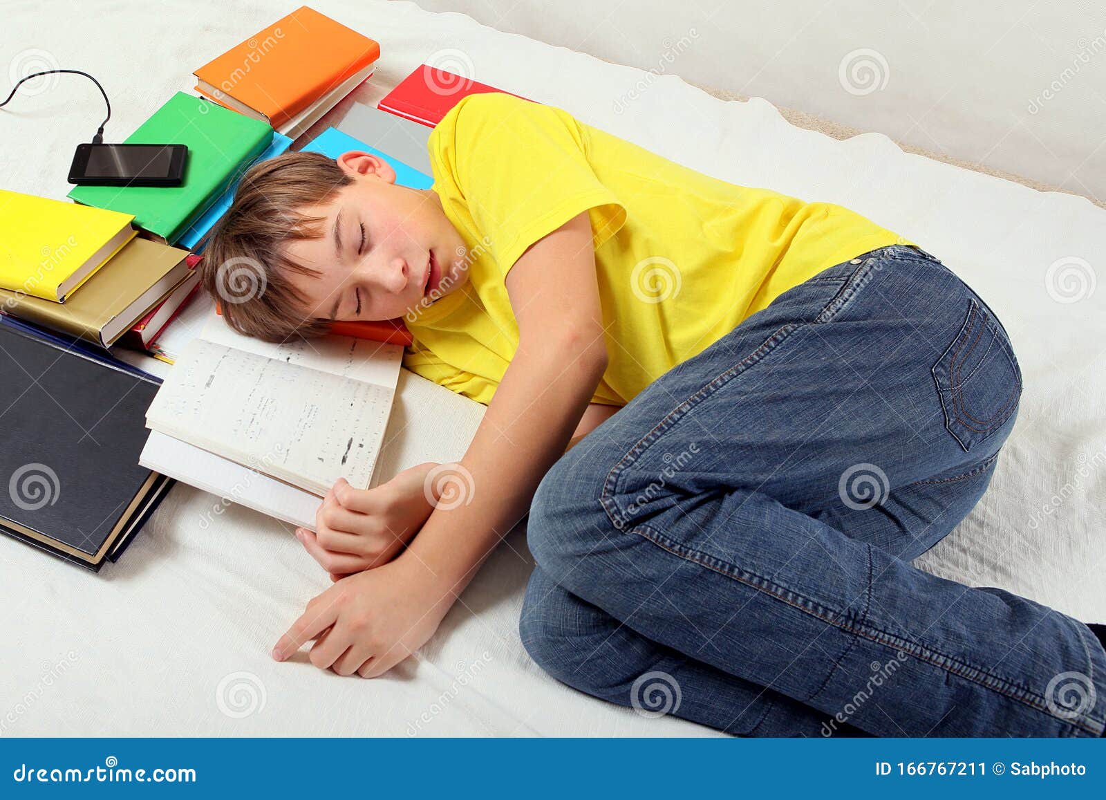 Boy sleeping on the Books stock image. Image of homework - 166767211