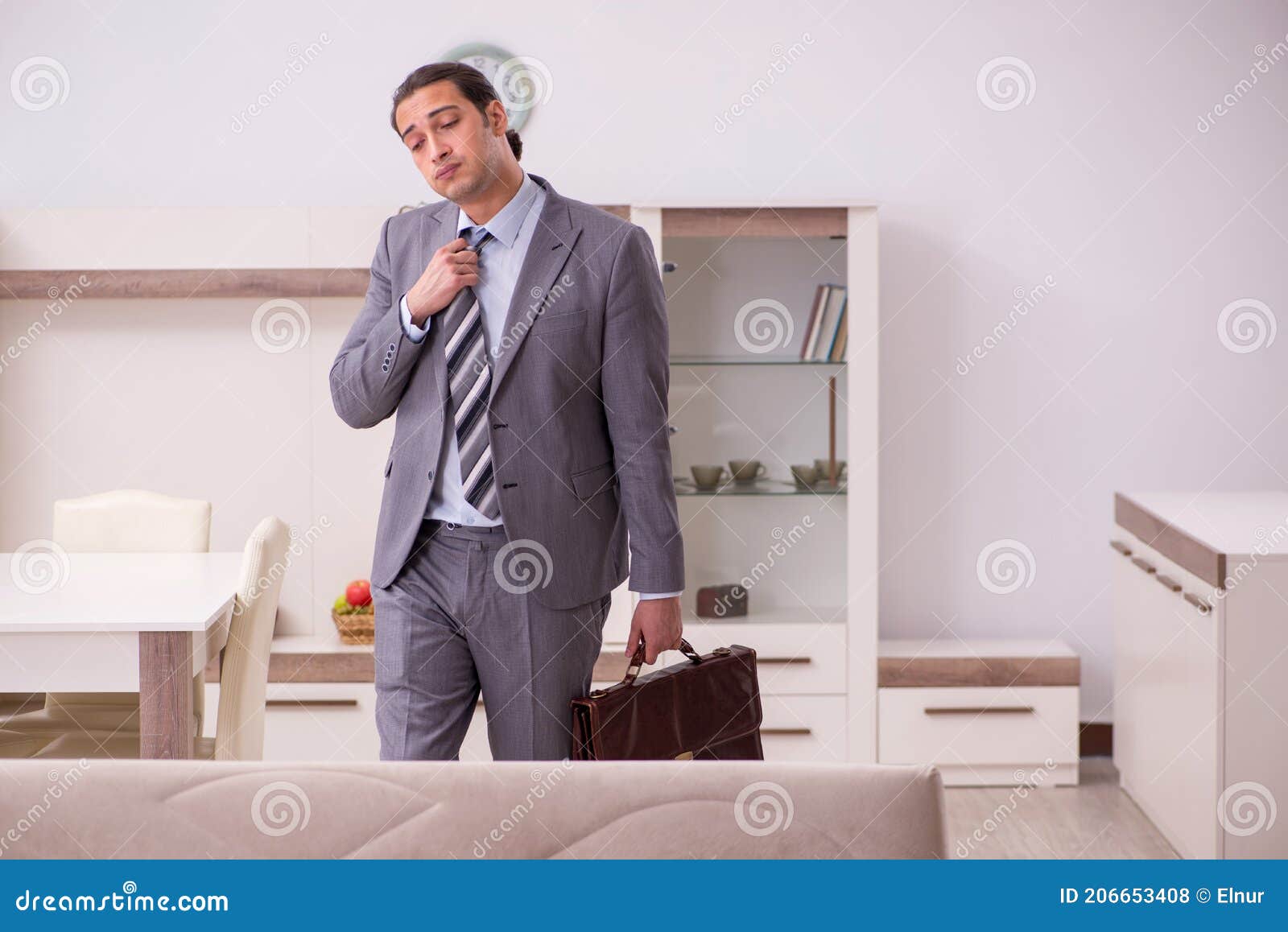 Tired Young Businessman Coming Home after Working Day Stock Photo ...