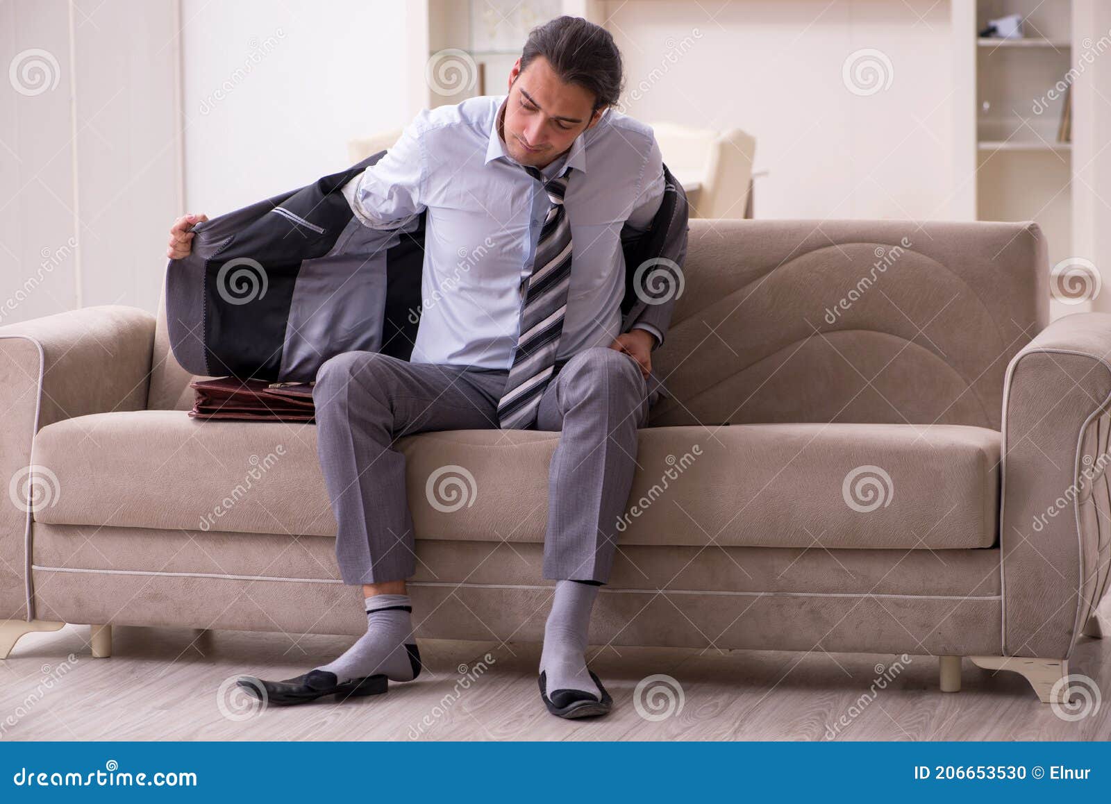 Tired Young Businessman Coming Home after Working Day Stock Photo ...