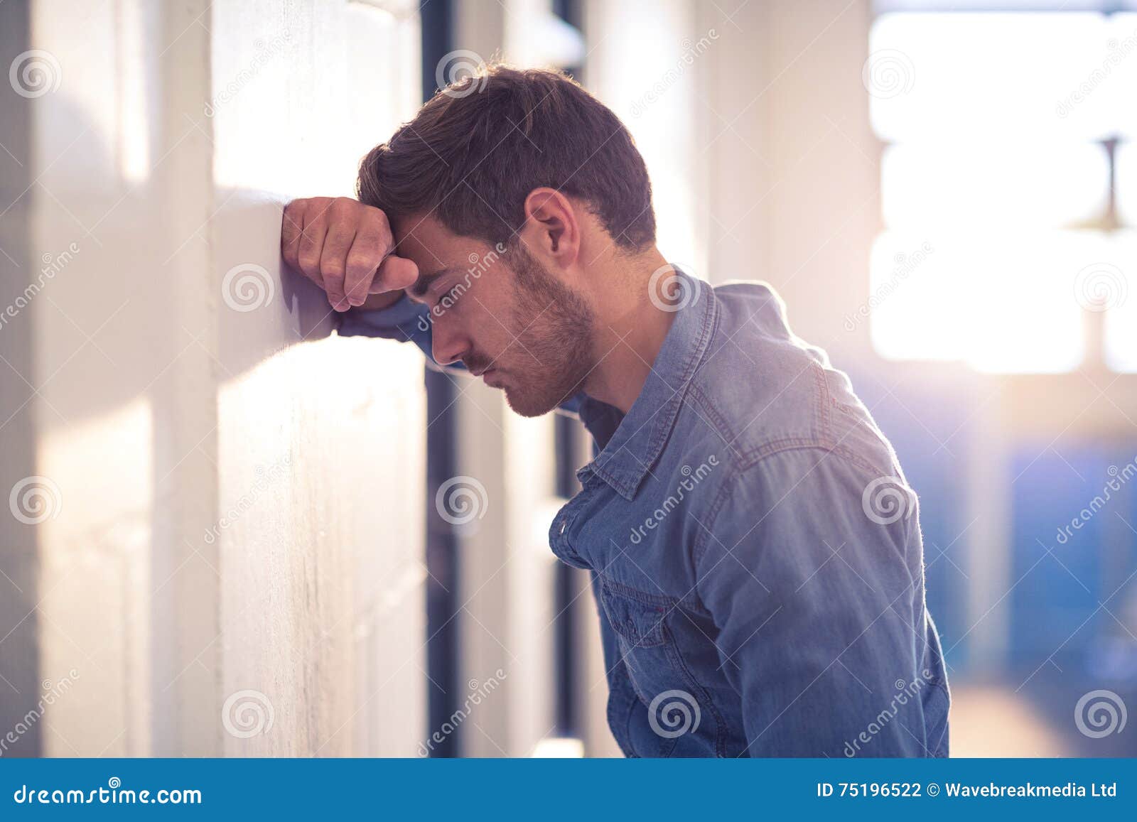 Tired Businessman Leaning on Wall Stock Photo - Image of male, leaning ...