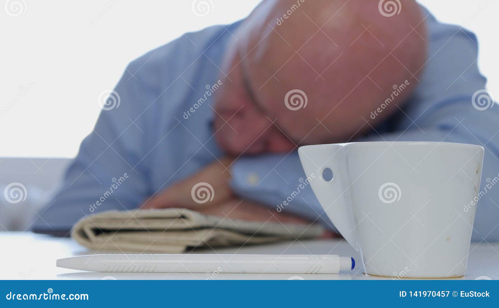 Tired Businessman Napping at Home with Coffee and Newspaper on the ...