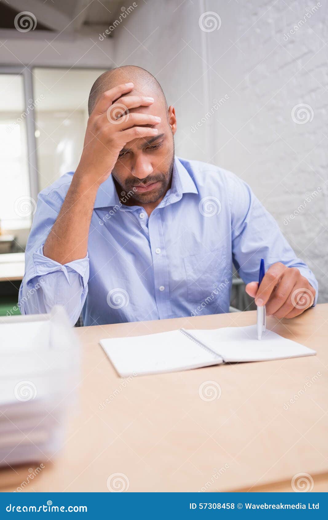 Tired Businessman with Paperwork at Desk Stock Photo - Image of ...