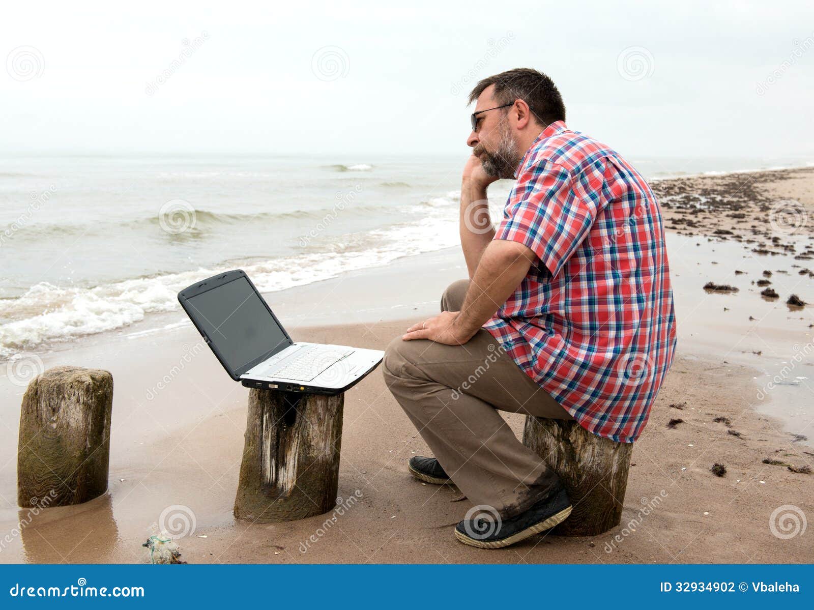 Tired Businessman Sitting with Notebook on Beach Stock Photo - Image of ...