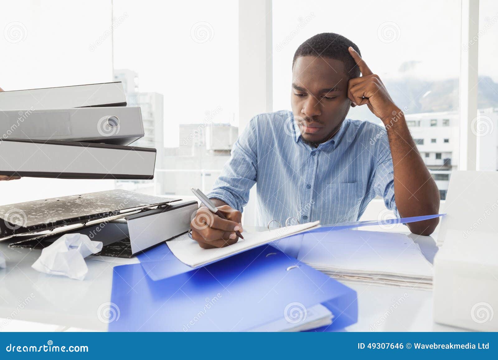 Tired Businessman Writing Notes at Desk Stock Photo - Image of ...