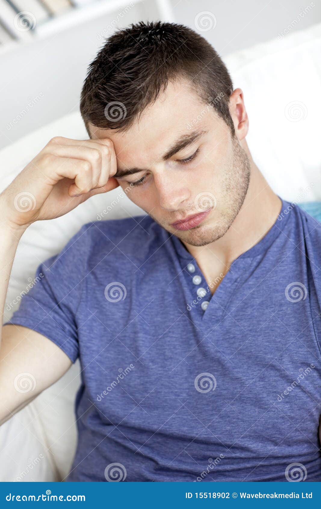 Tired Caucasian Man Sitting on the Sofa Stock Photo - Image of ...