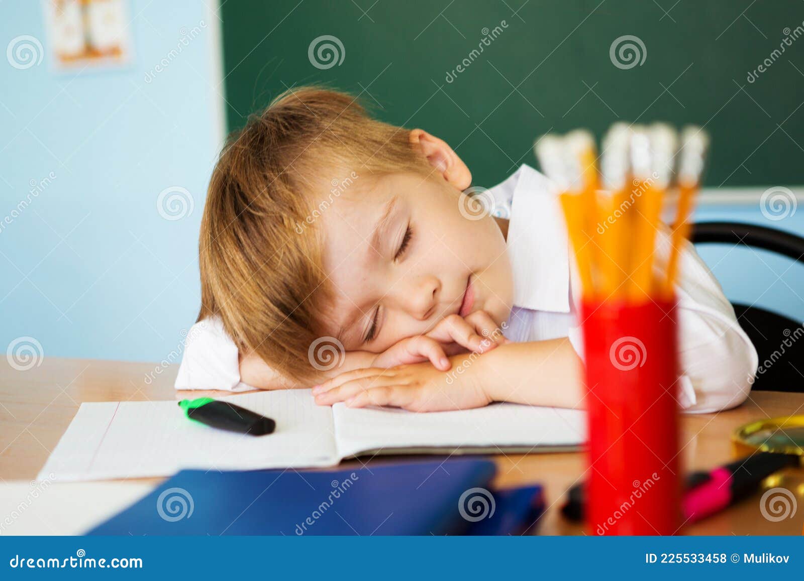 Tired Child Sleeping while Studying in the Primary School Classroom ...