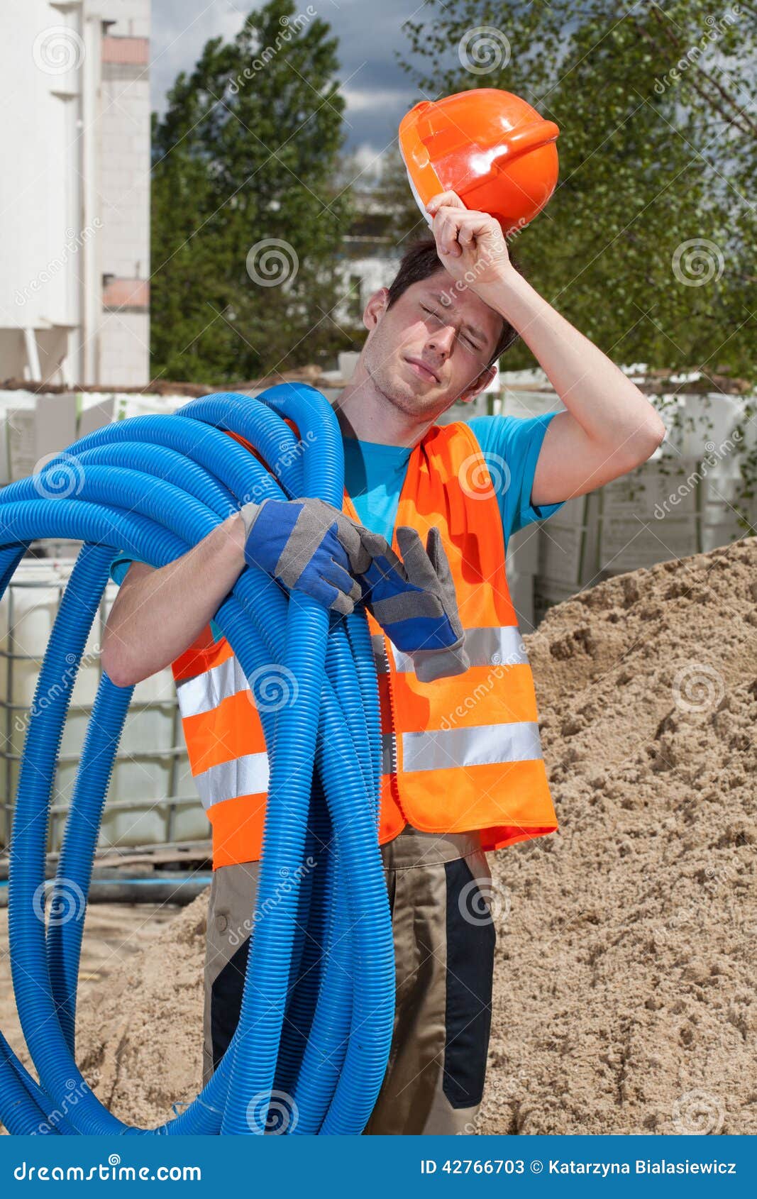 Tired Construction Worker Holding Pipes Stock Image - Image of build ...