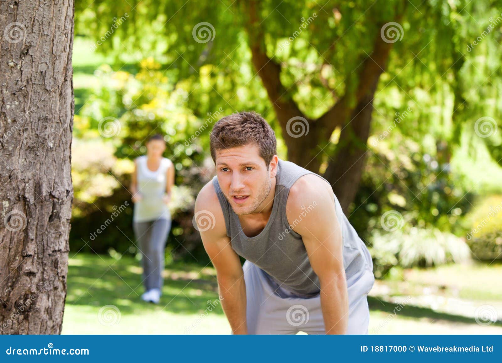 Tired couple in the park stock photo. Image of health - 18817000