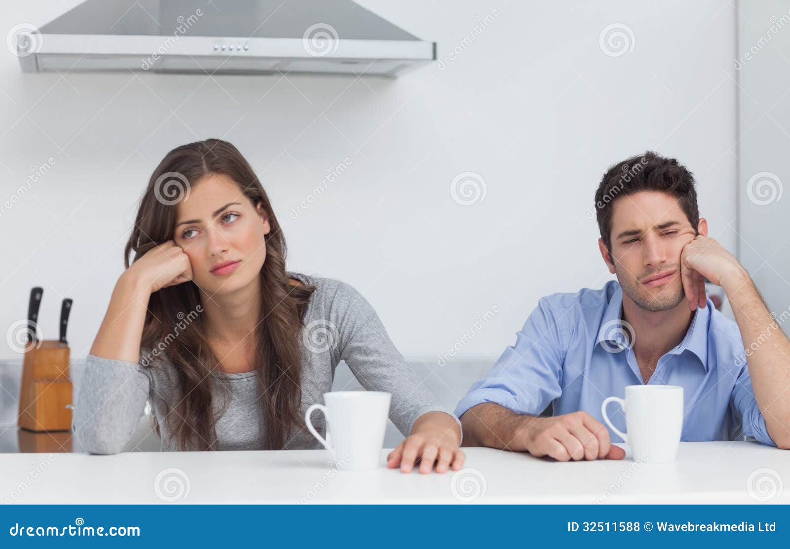 Tired Couple Sitting at the Table with a Cup of Coffee Stock Photo ...