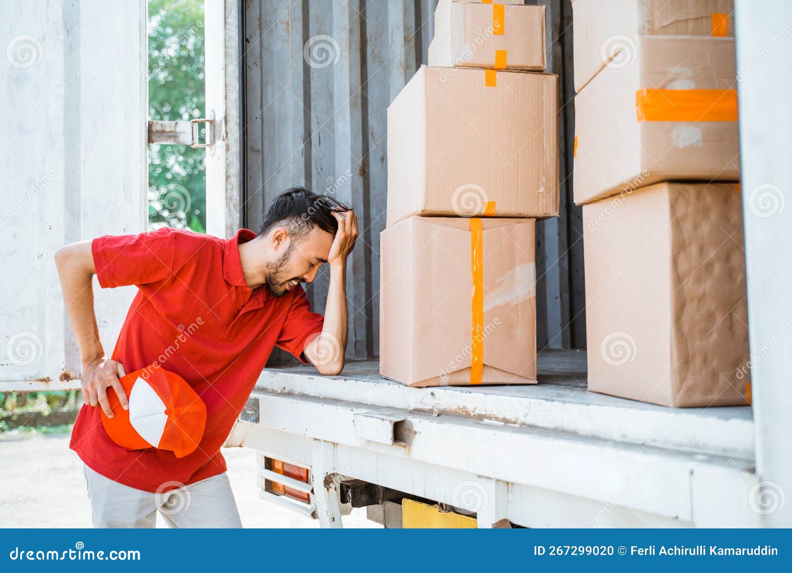 Tired Delivery Man Having Headache while Working with Cardboard Boxes ...
