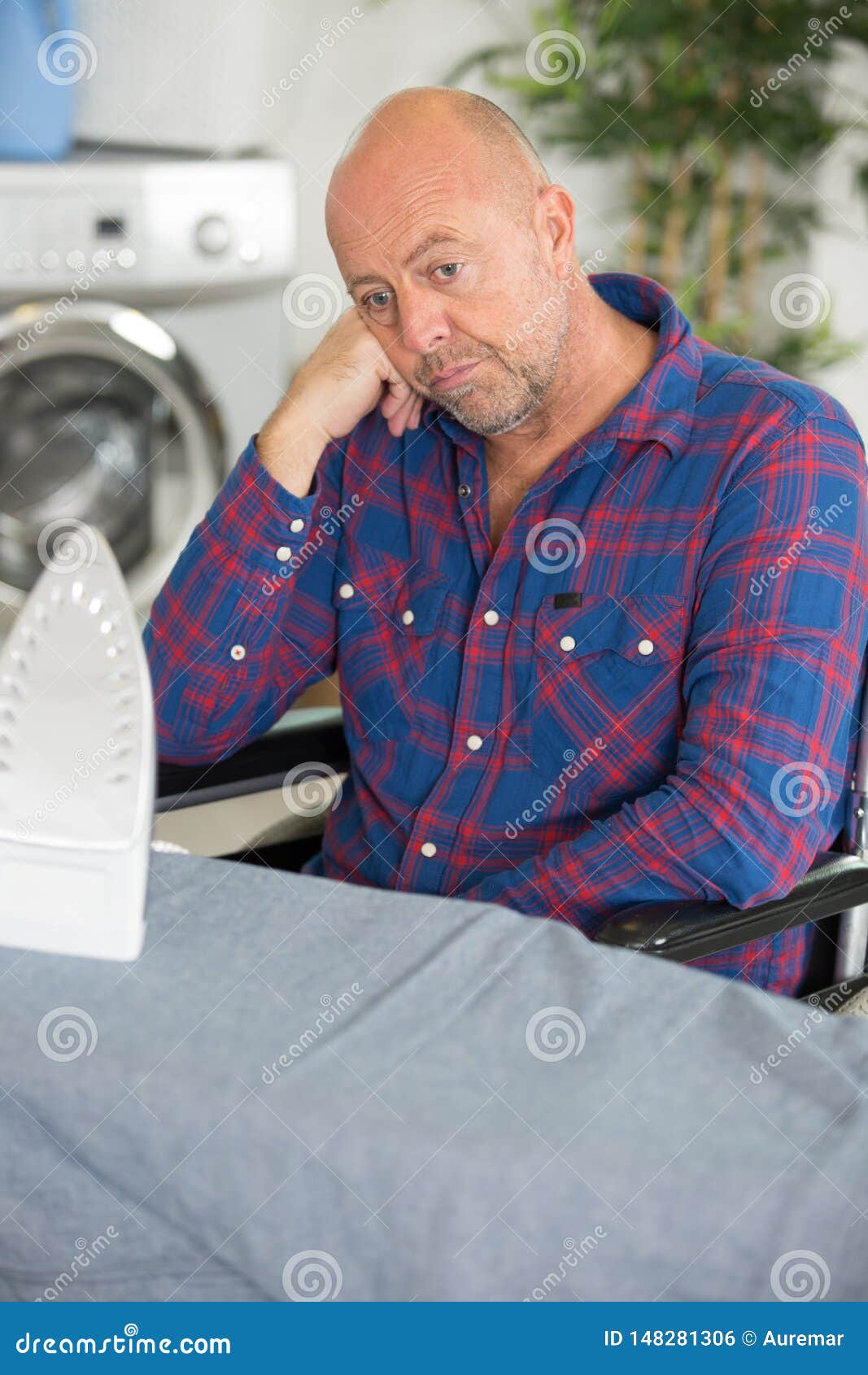 Tired Disabled Man with Iron and Ironing Board Stock Photo - Image of ...