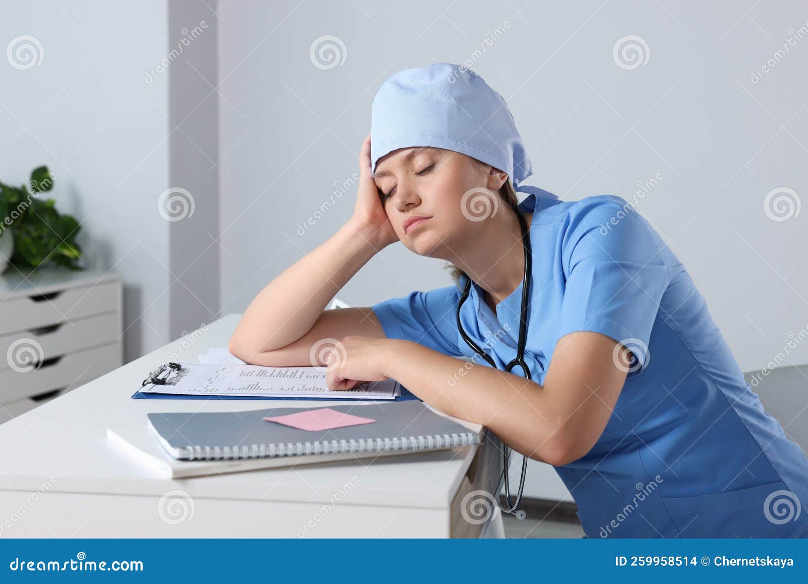 Tired Young Doctor Sleeping at Workplace in Office Stock Photo - Image ...