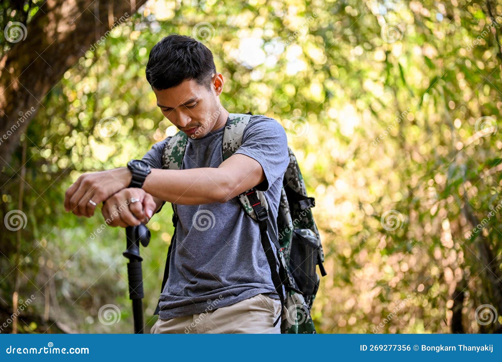 Tired and Exhausted Asian Male Traveler with Trekking Gear Hiking in ... Tired and Exhausted Asian Male Traveler with Trekking Gear Hiking in ...