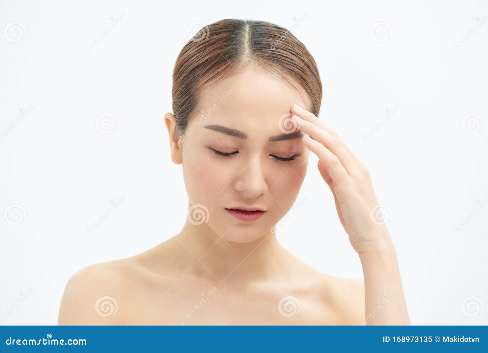 Tired and Exhausted Asian Woman Touching Her Forehead Over White ... Tired and Exhausted Asian Woman Touching Her Forehead Over White ...