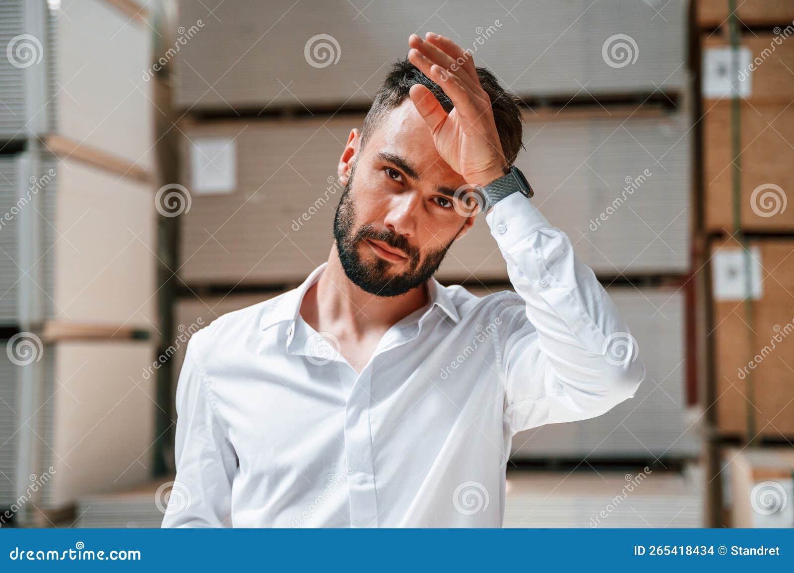 Tired, Feeling Bad. Storage Worker is in the Warehouse with Bunch of ...