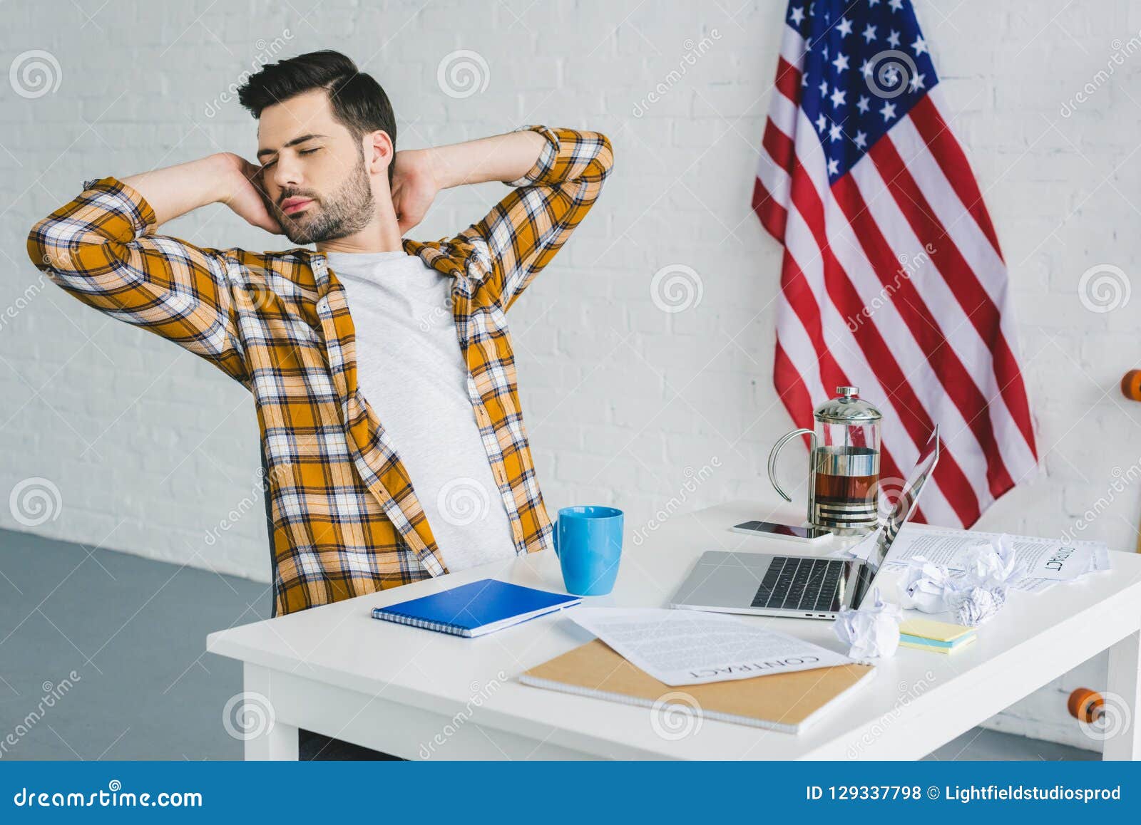 Tired Freelancer Stretching by Working Table Stock Photo - Image of ...