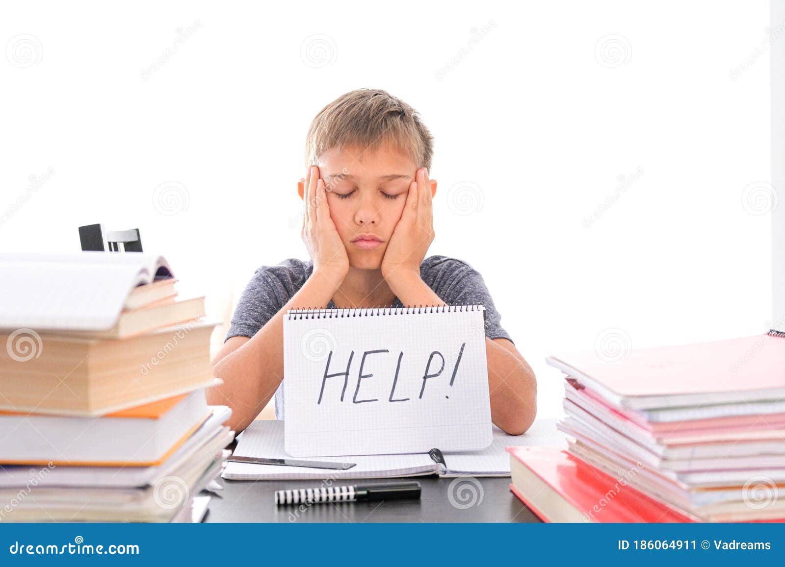 Tired Frustrated Boy Sitting at the Table, Doing His Homework among ...