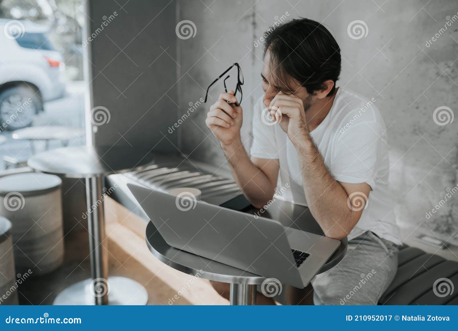 Stressed and Frustrated Man Sitting in Cafe and Working in Laptop Stock ...