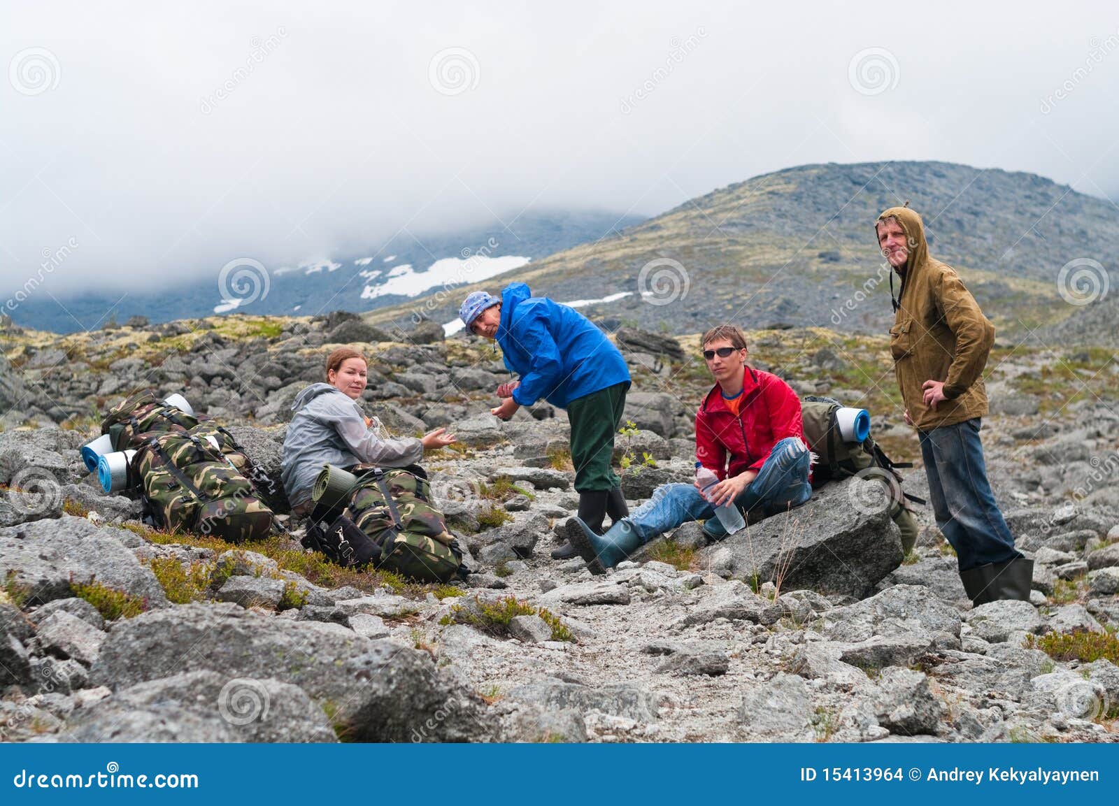 Tired Group of Backpackers in Mountains Stock Photo - Image of family ...
