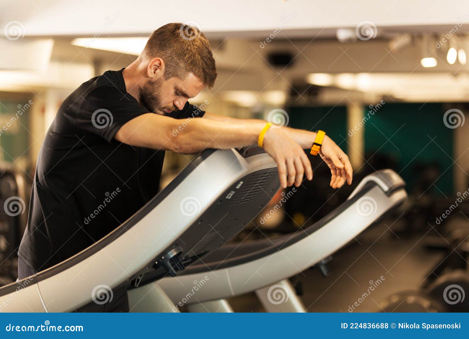Tired Guy Walking on a Treadmill. Exhausted Man Resting Stock Photo ...