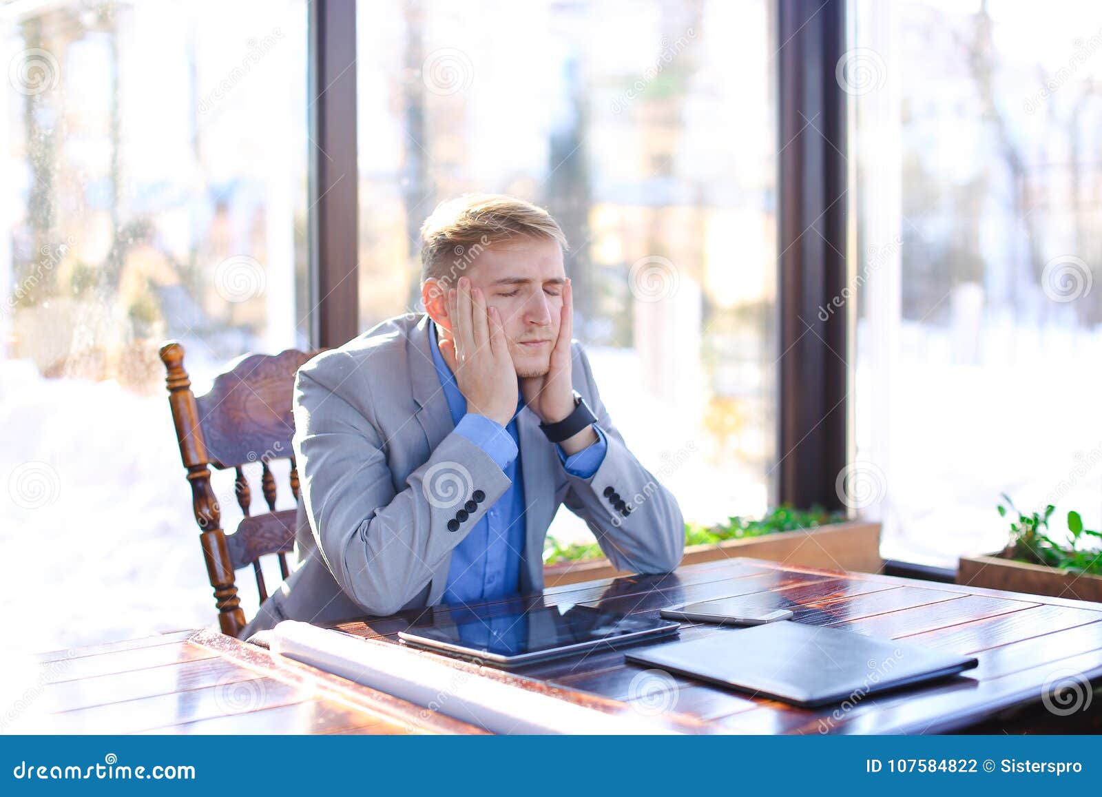 Young Tired Manager Having Break at Cafe with Roll Paper, Tablet Stock ...
