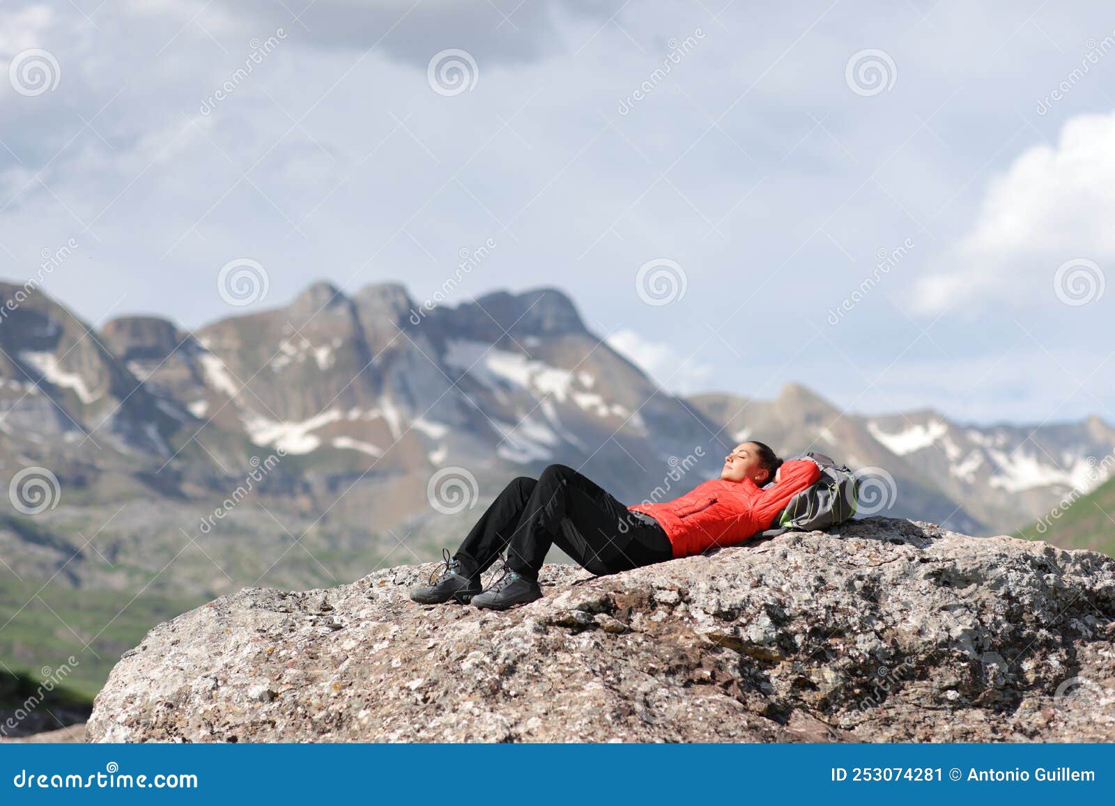 Tired Hiker in Red Resting Lying on the Top of a High Mountain Stock ...