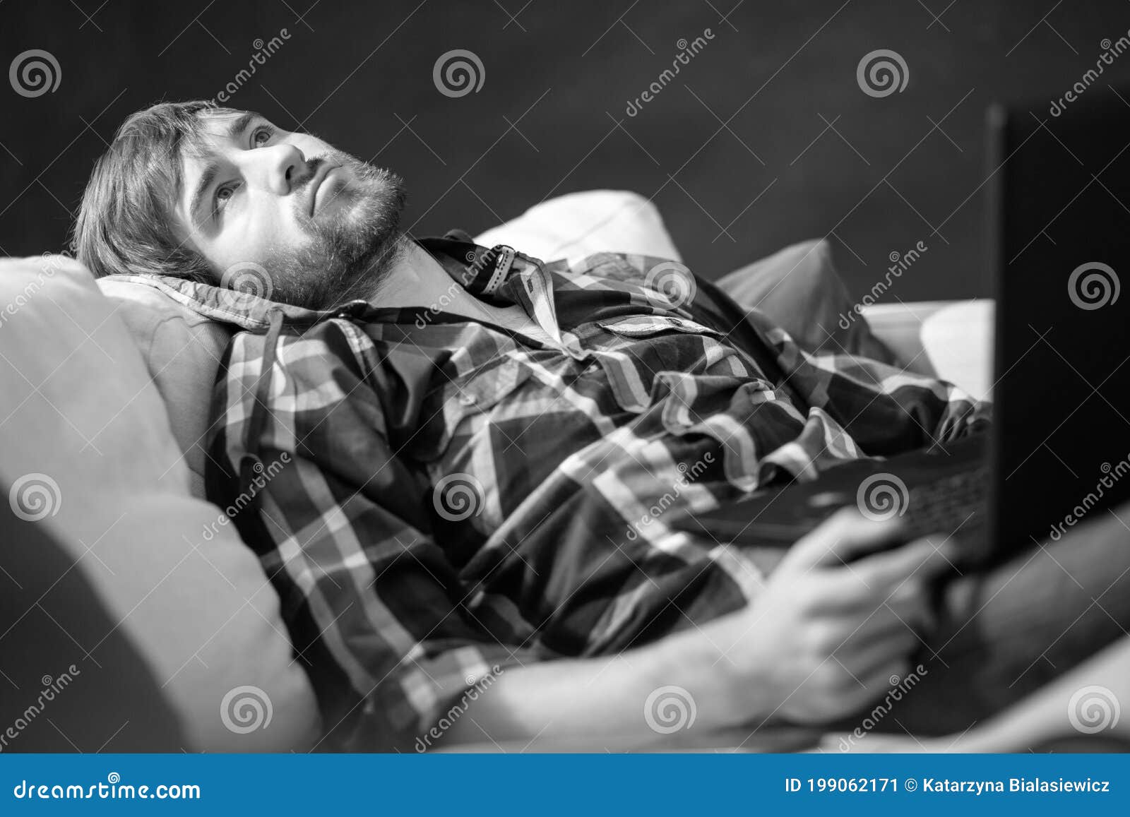 Tired Man Lying on Couch and Looking into Space Stock Image - Image of ...