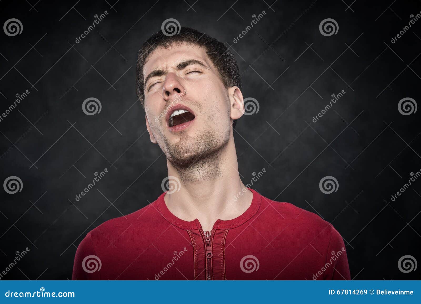Tired looking young man. stock image. Image of person - 67814269