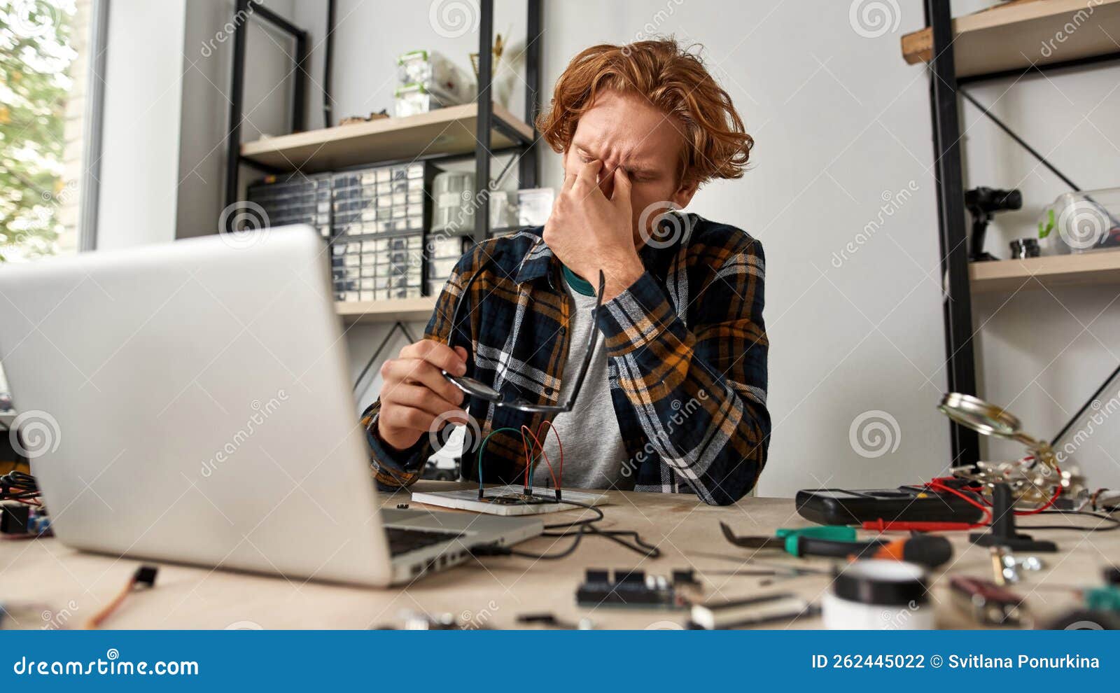Tired Male it Engineer Using and Working on Laptop Stock Photo - Image ...