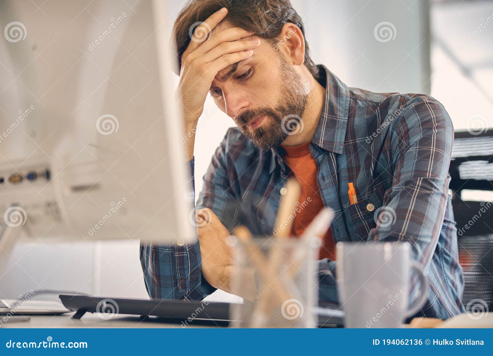 Exhausted Young Man Using Computer at Work Stock Photo - Image of ...