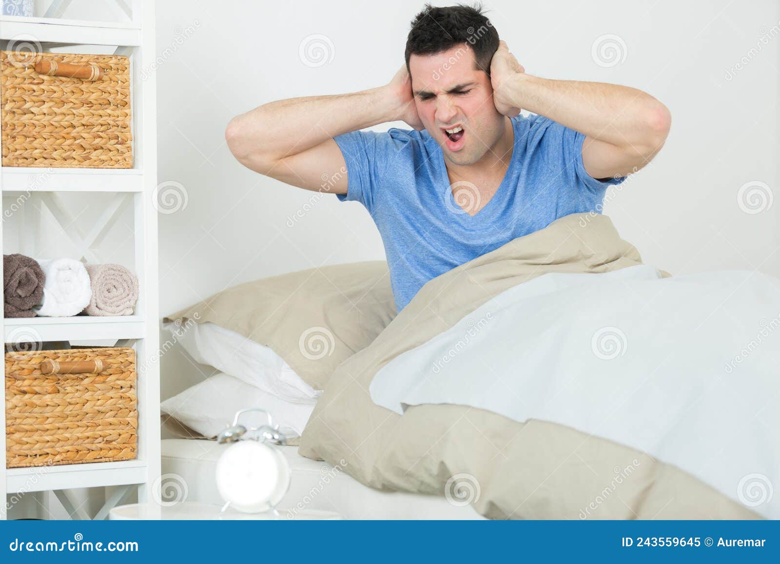 Tired man in bed stock image. Image of ringing, hour - 243559645