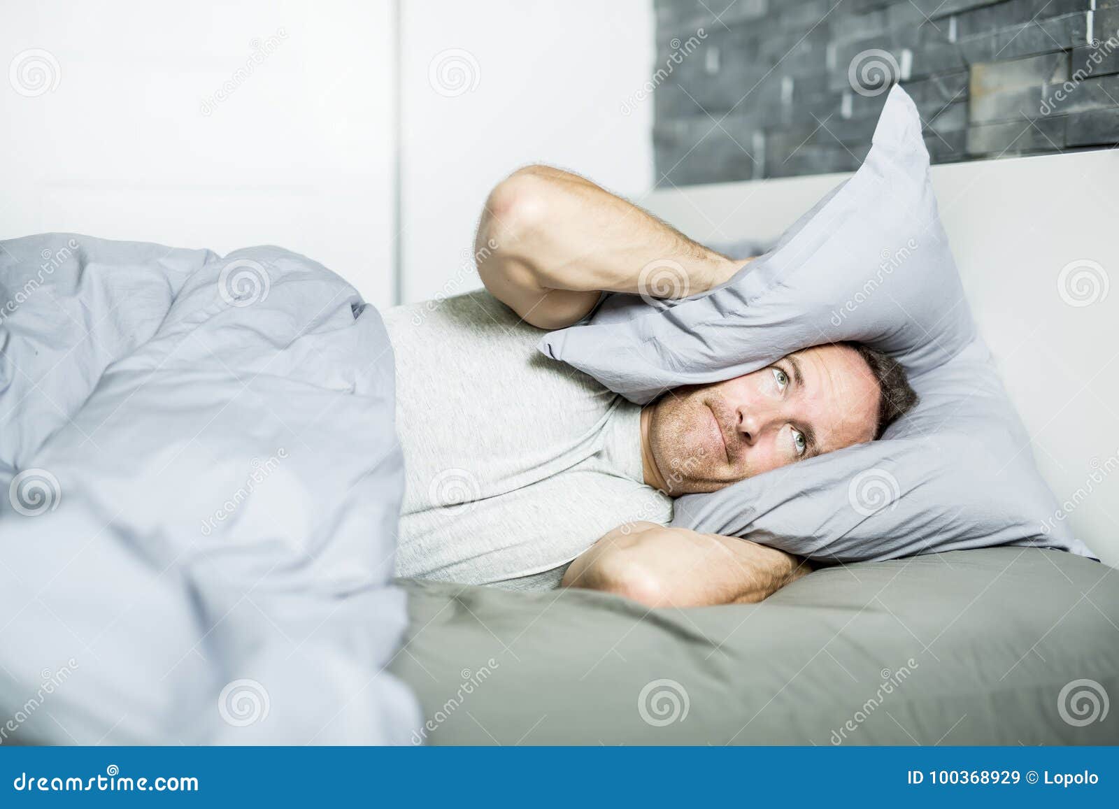 Tired man in the bed stock image. Image of concept, bedroom - 100368929