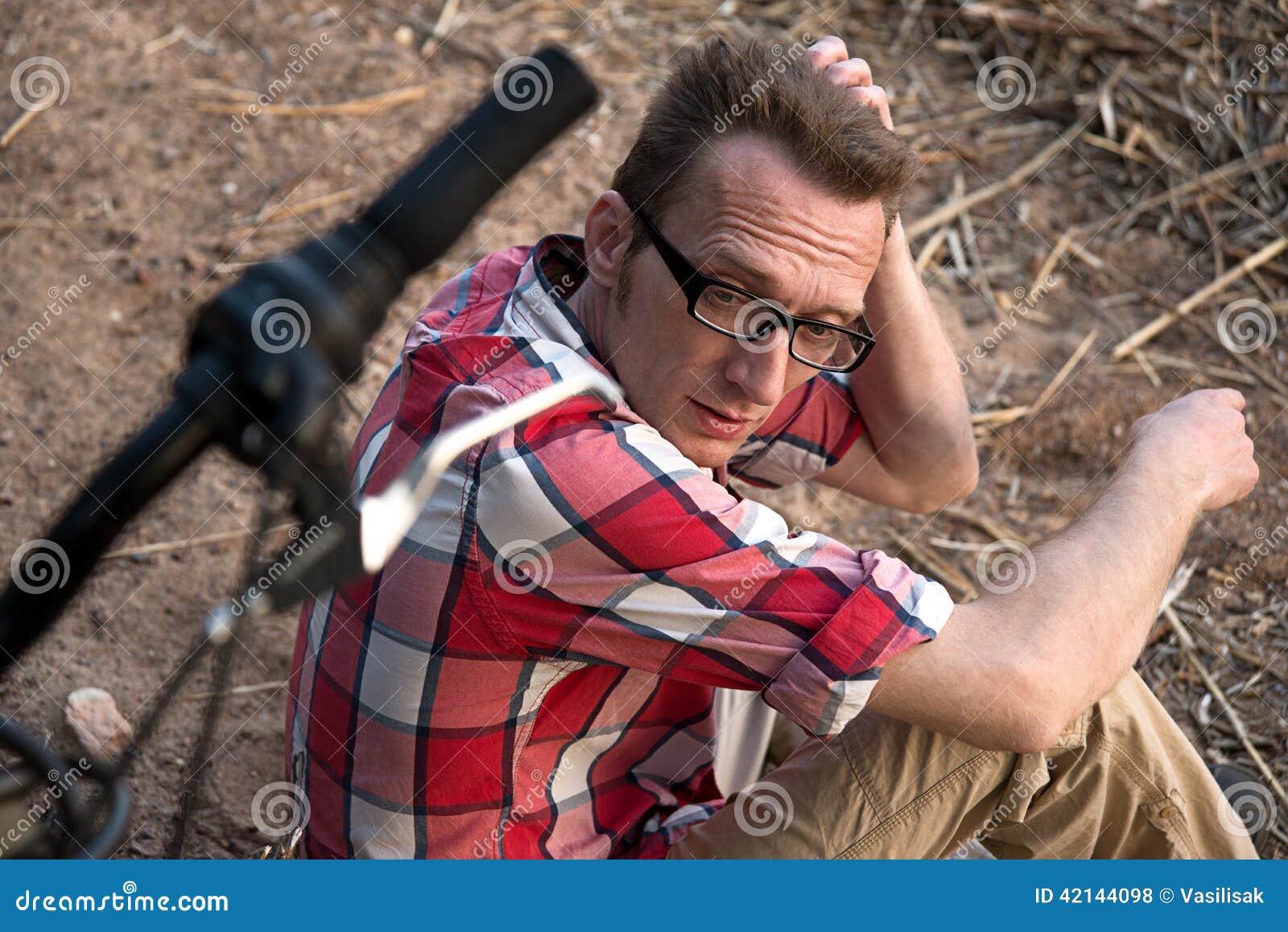 A Tired Man with a Broken Bike Stock Photo - Image of sunset, beige ...